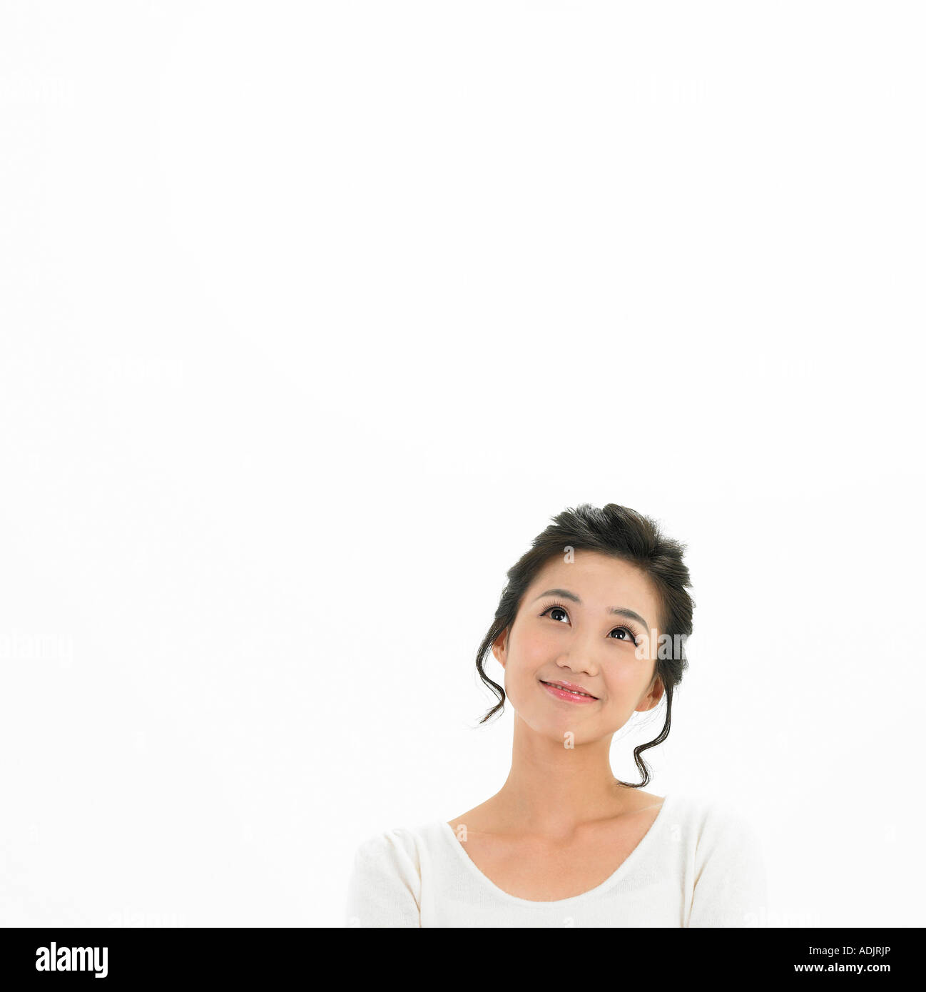 A woman is thinking something with a smile Stock Photo - Alamy