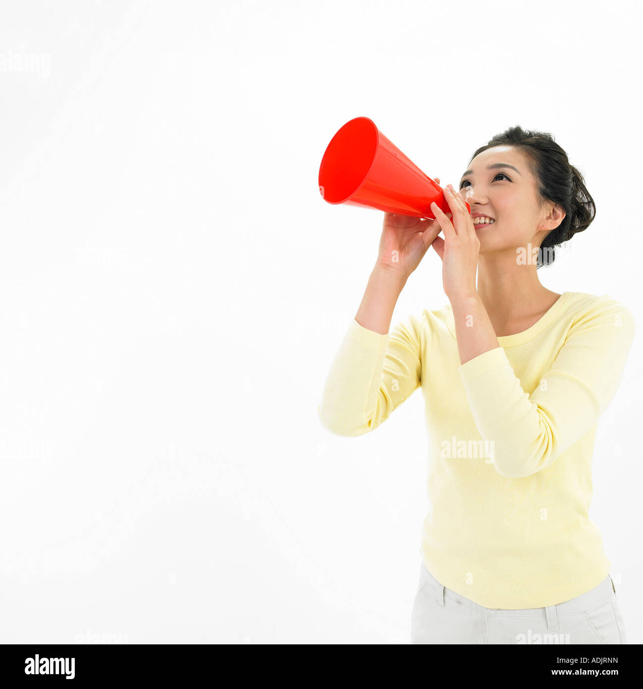 A woman is holding a funnel Stock Photo - Alamy