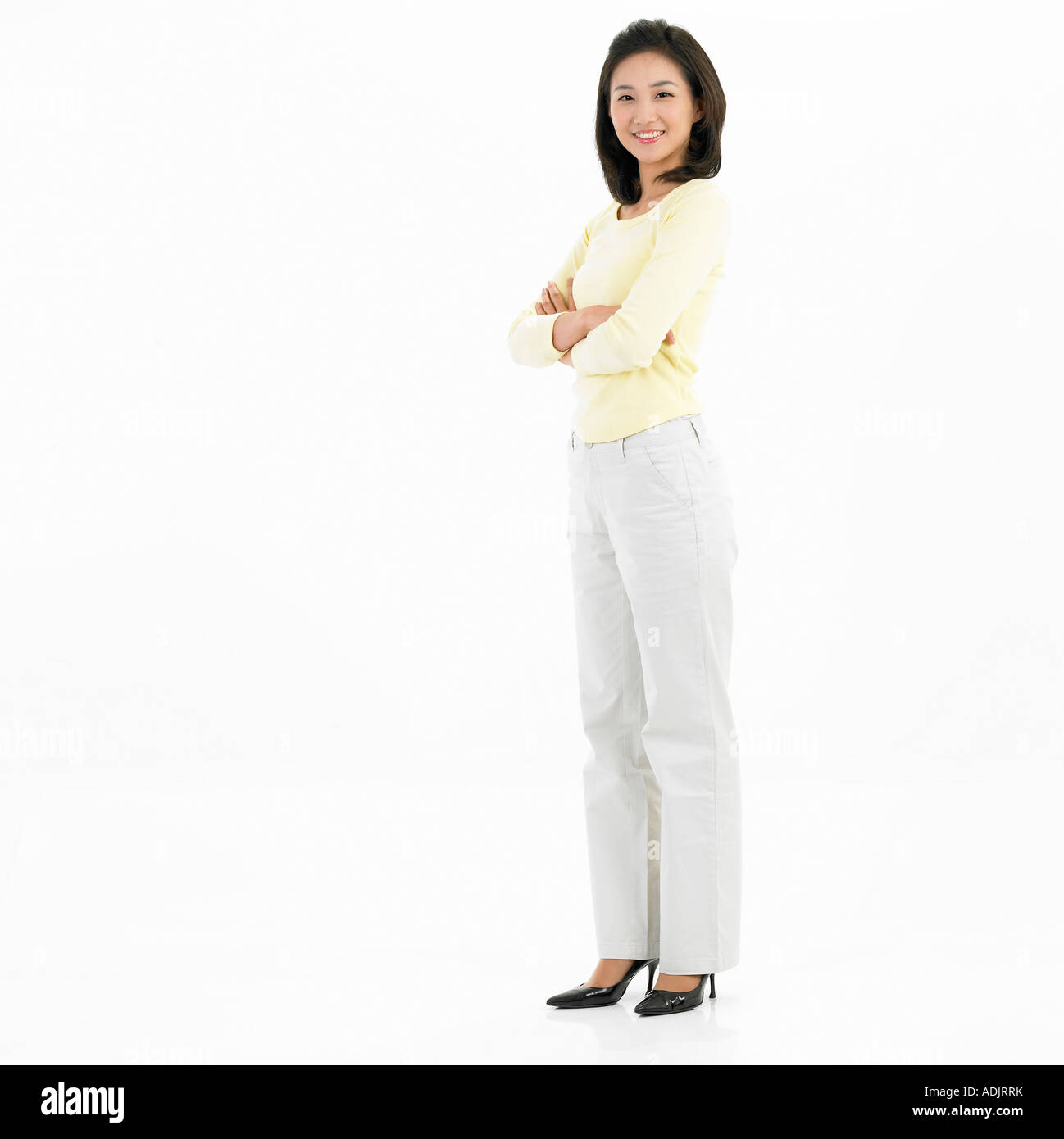 A woman is folding her arms Stock Photo - Alamy