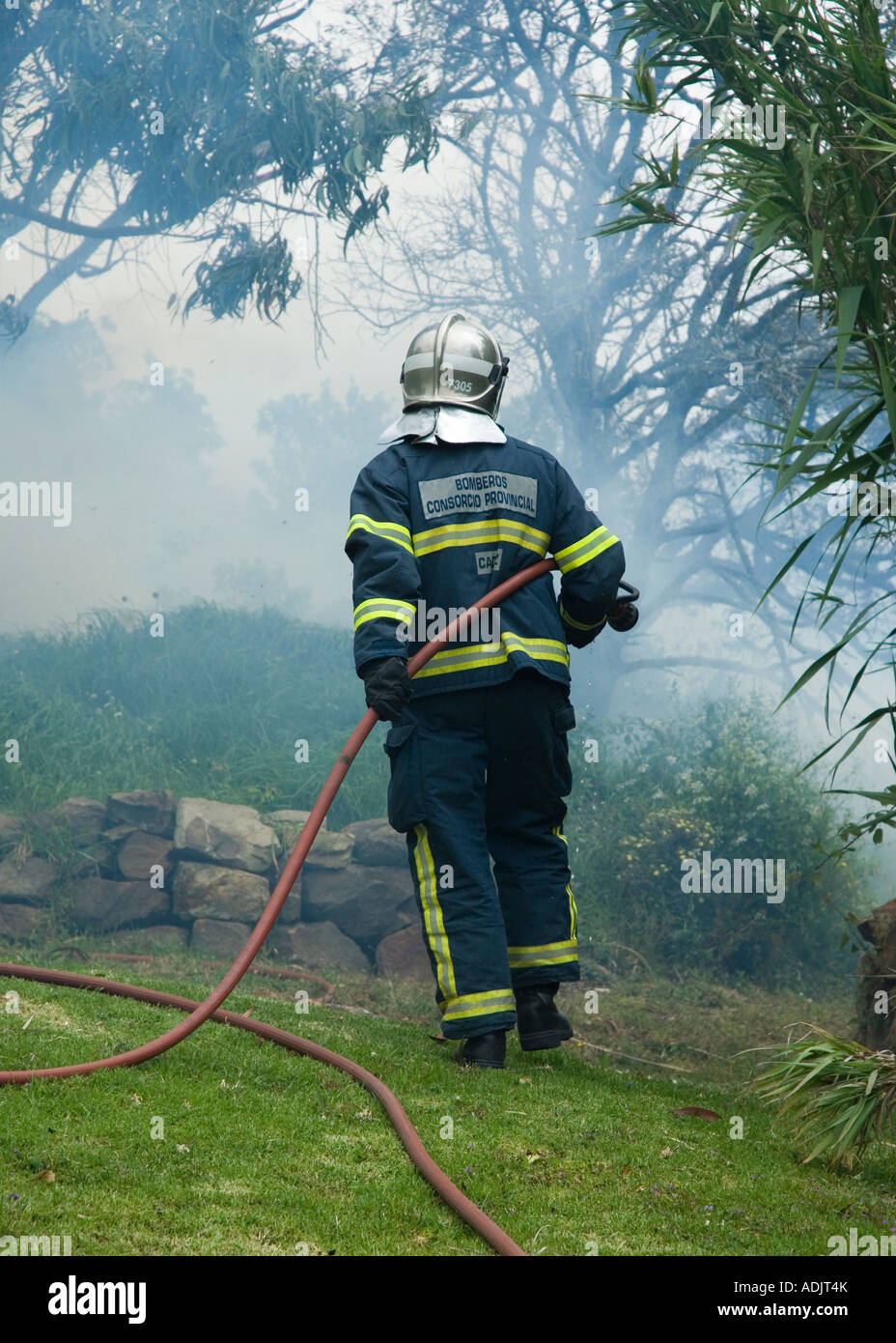 fireman with hose Stock Photo - Alamy