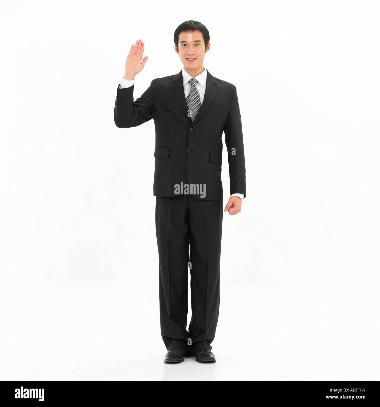 A man raising a hand and swearing Stock Photo - Alamy