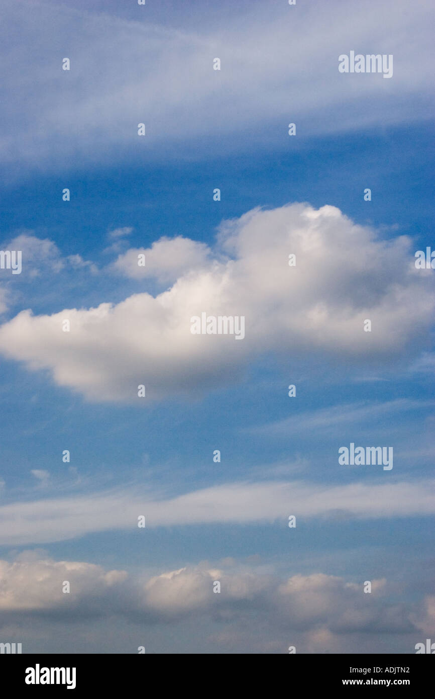Blue sky with a single cumlus cloud floating Stock Photo - Alamy