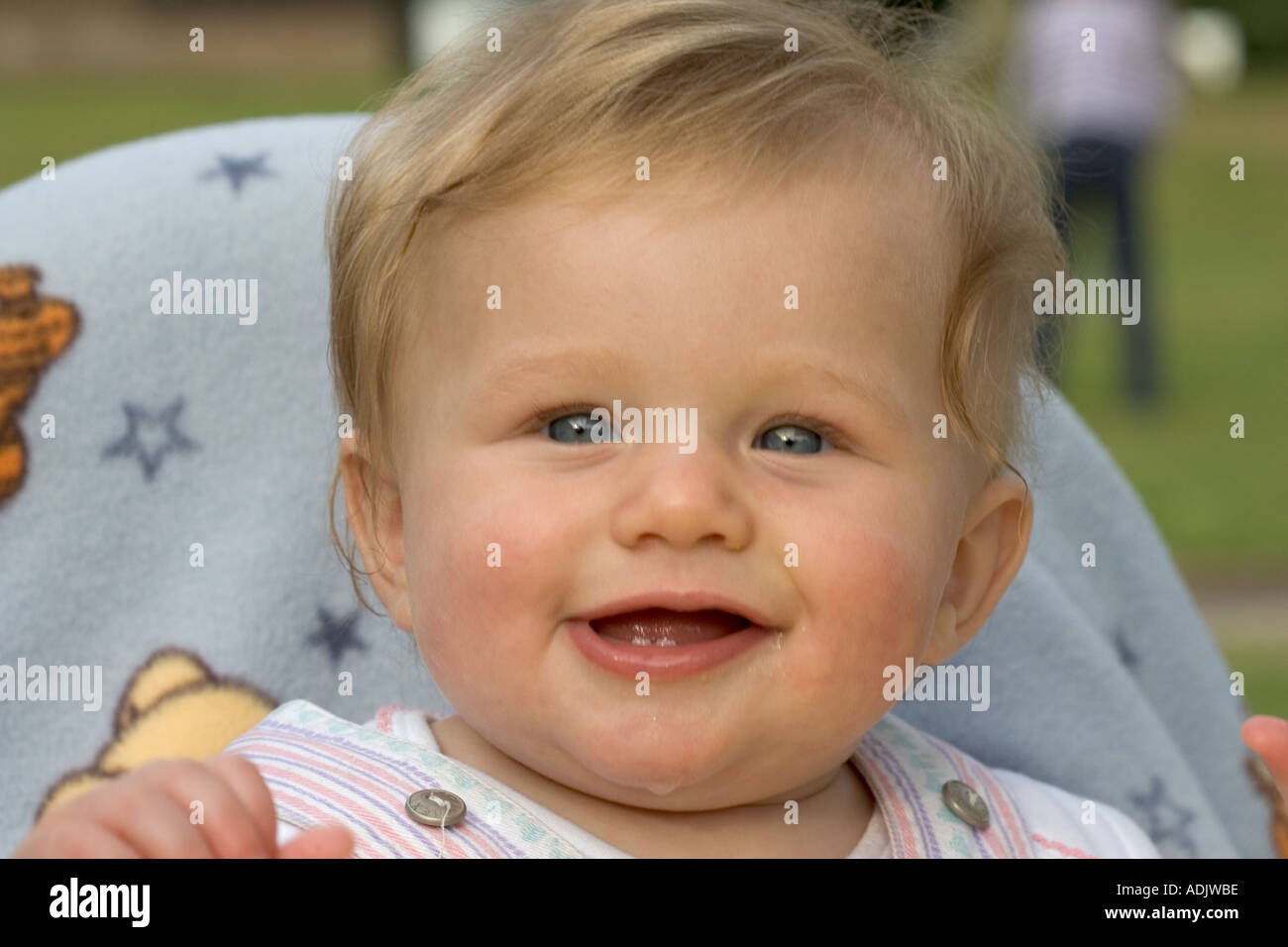 6 month old baby Holly sitting up and smiling in high chair UK Stock ...