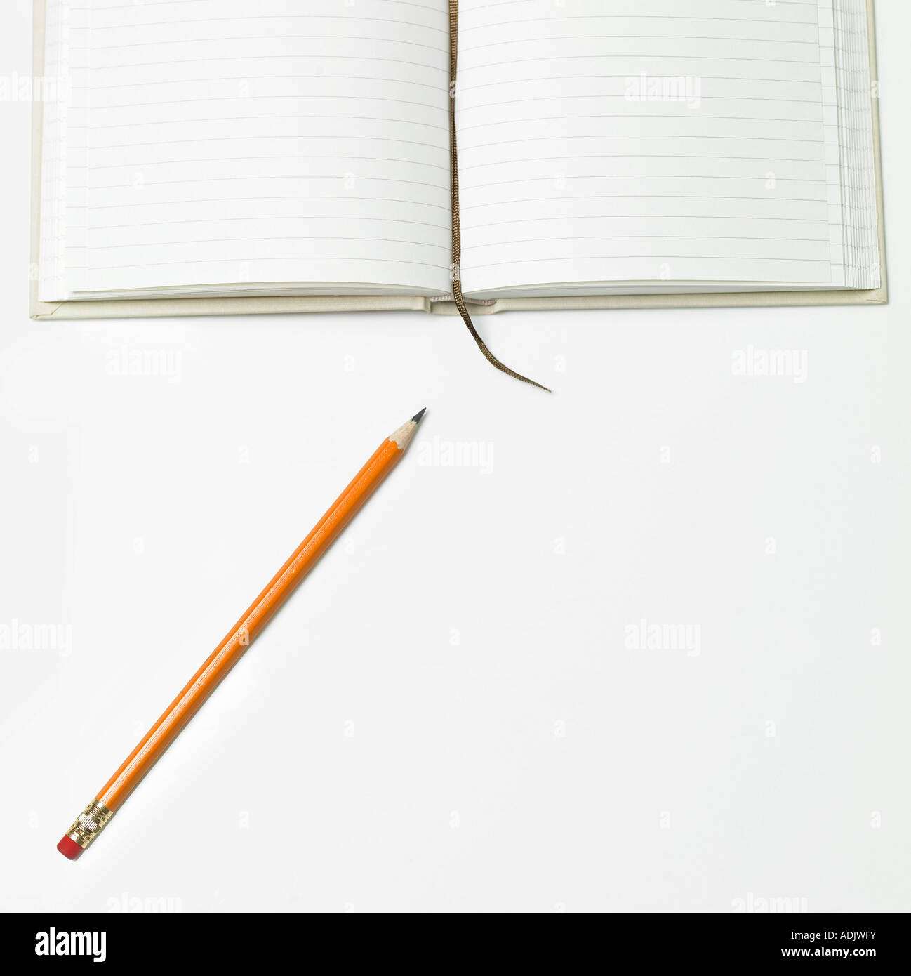 A pencil and a opened notebook Stock Photo - Alamy