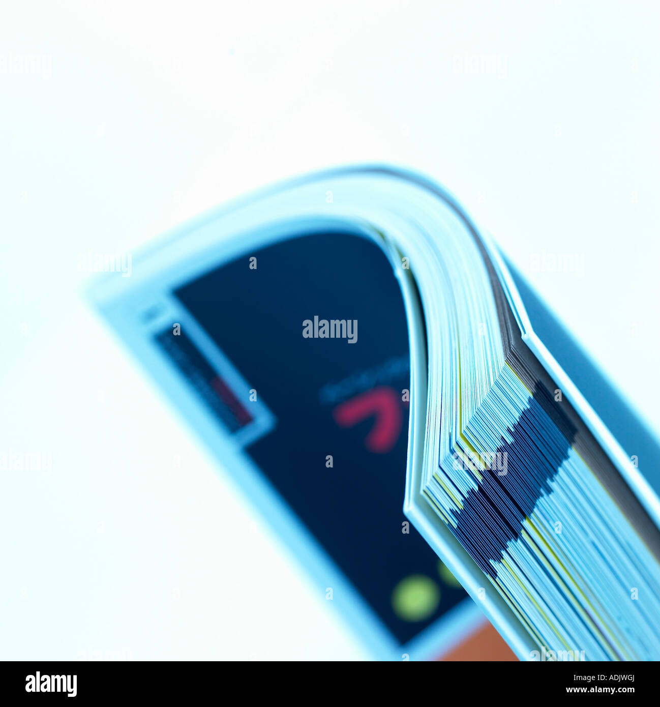 A magazine is curved Stock Photo - Alamy