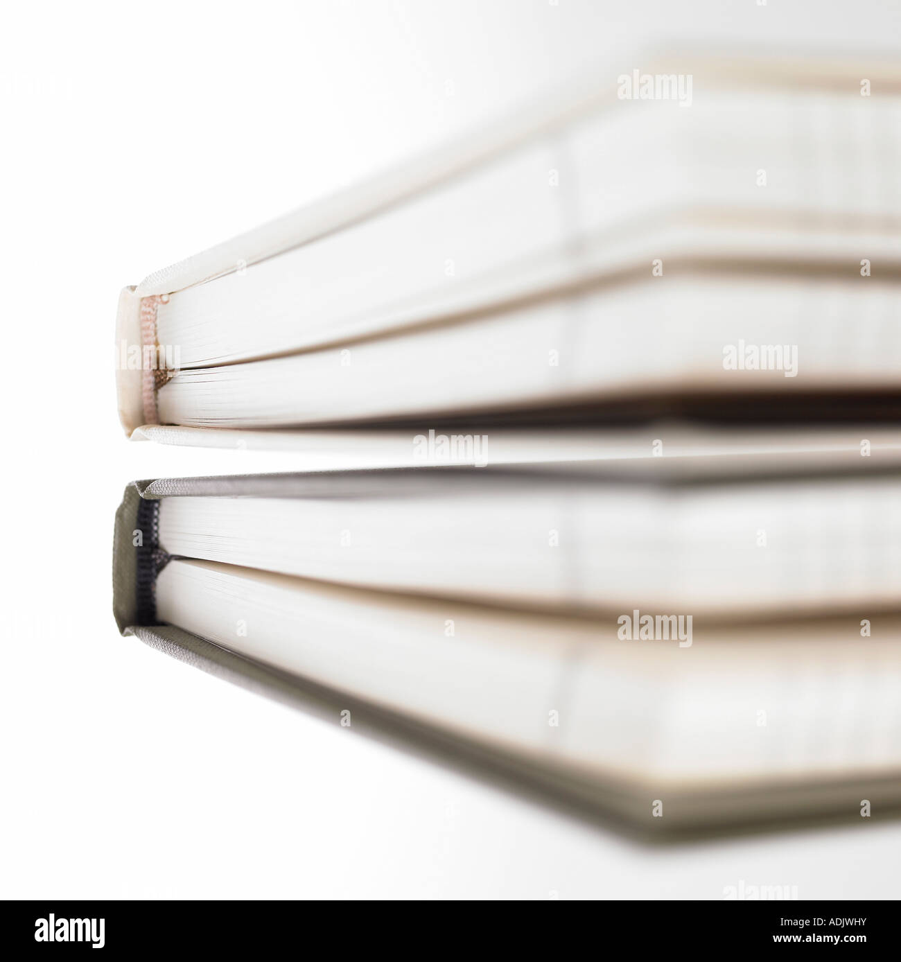 Two books lying one upon another Stock Photo - Alamy