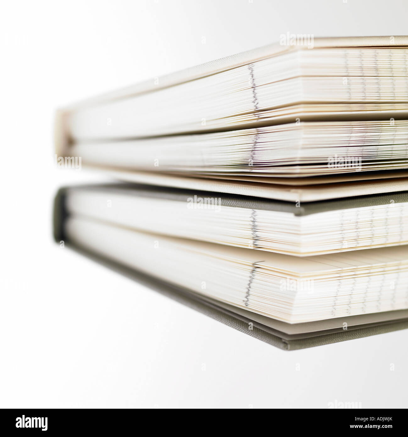 Two books lying one upon another Stock Photo - Alamy