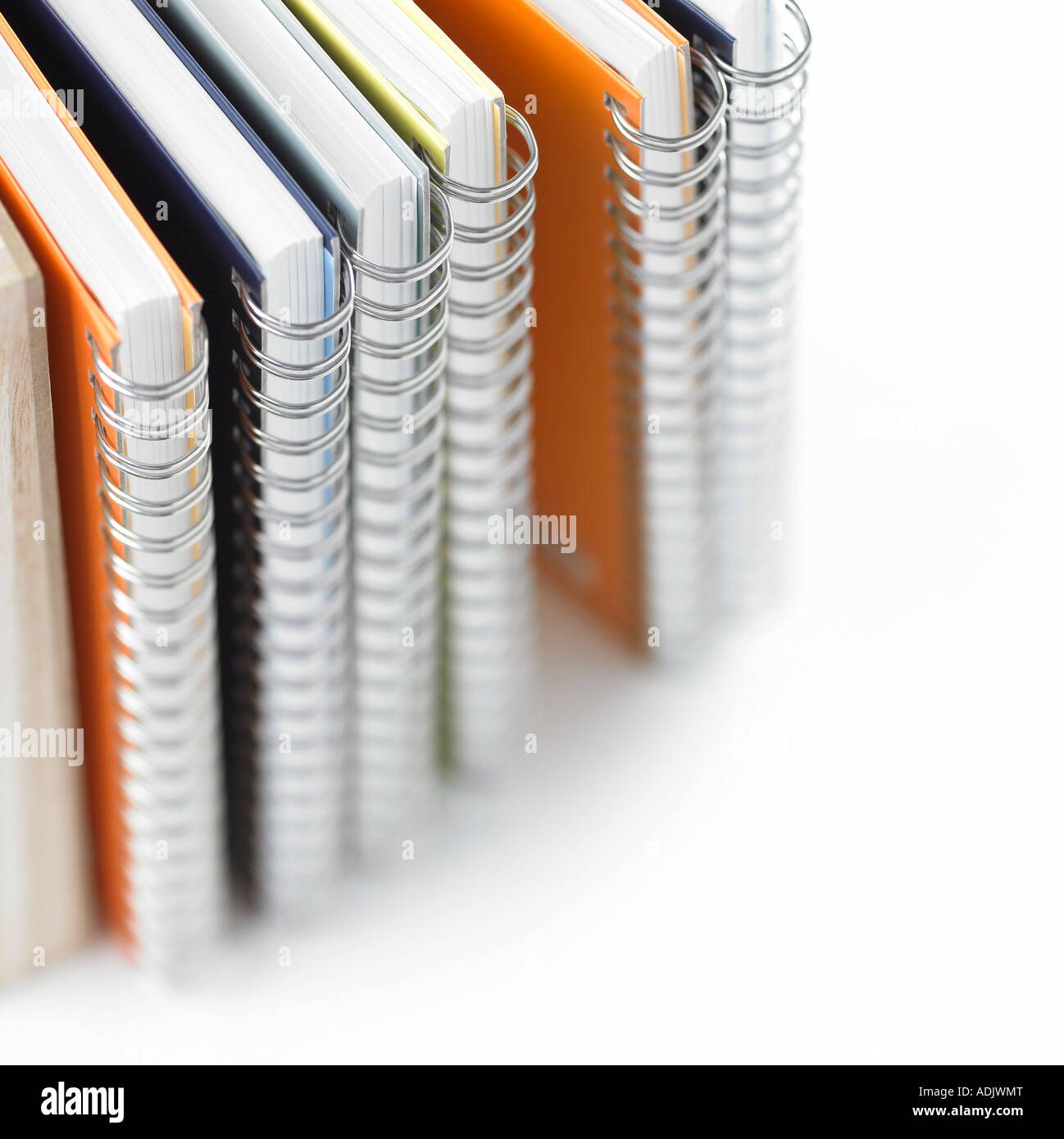 Notebooks with spring standing in a line Stock Photo - Alamy