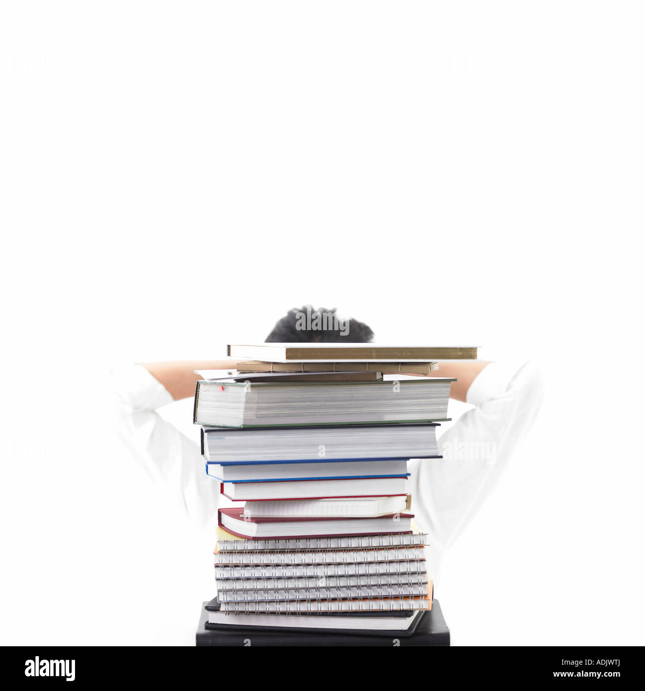 A person leaning against many books Stock Photo - Alamy