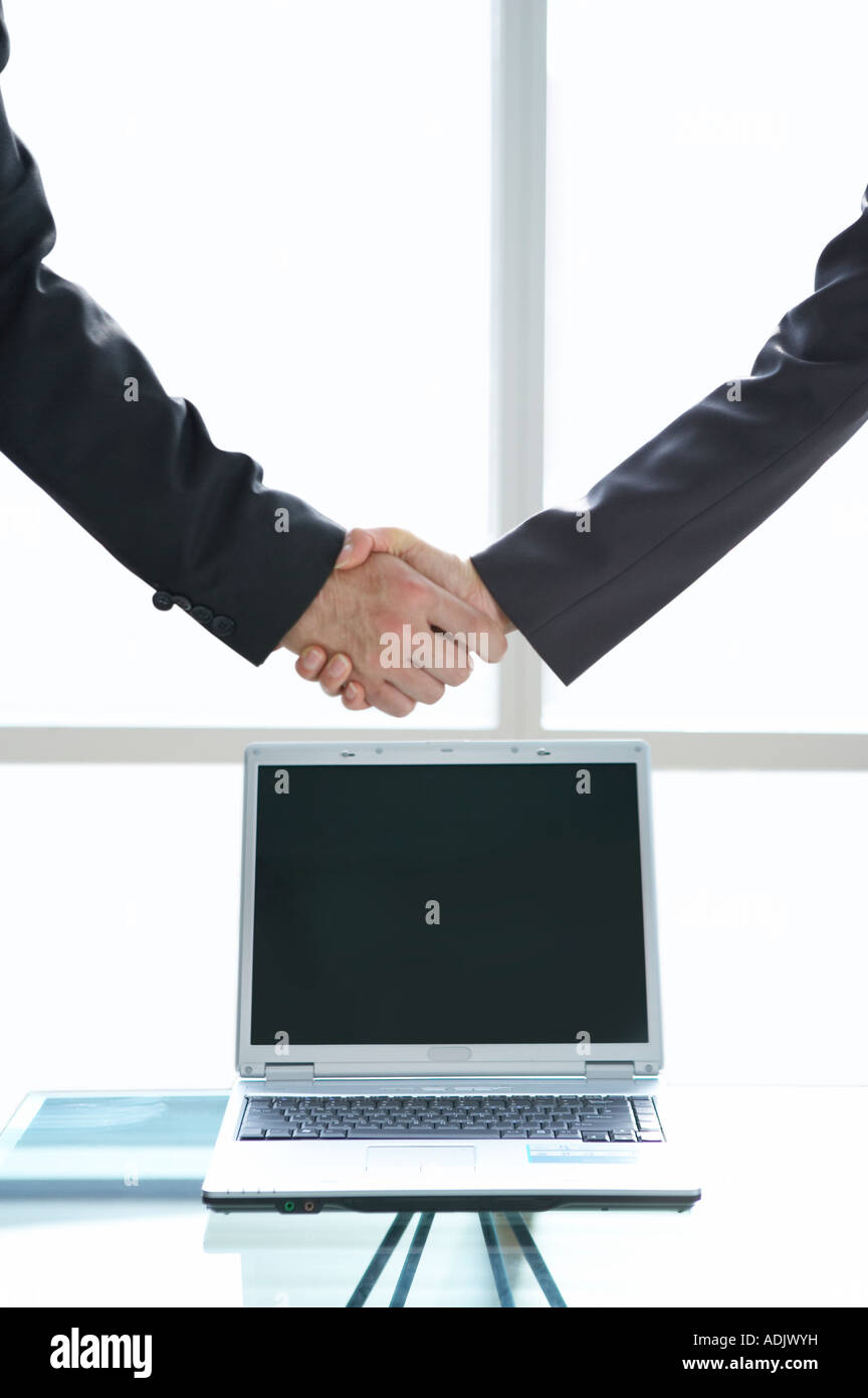 Two men shaking hands each other Stock Photo - Alamy