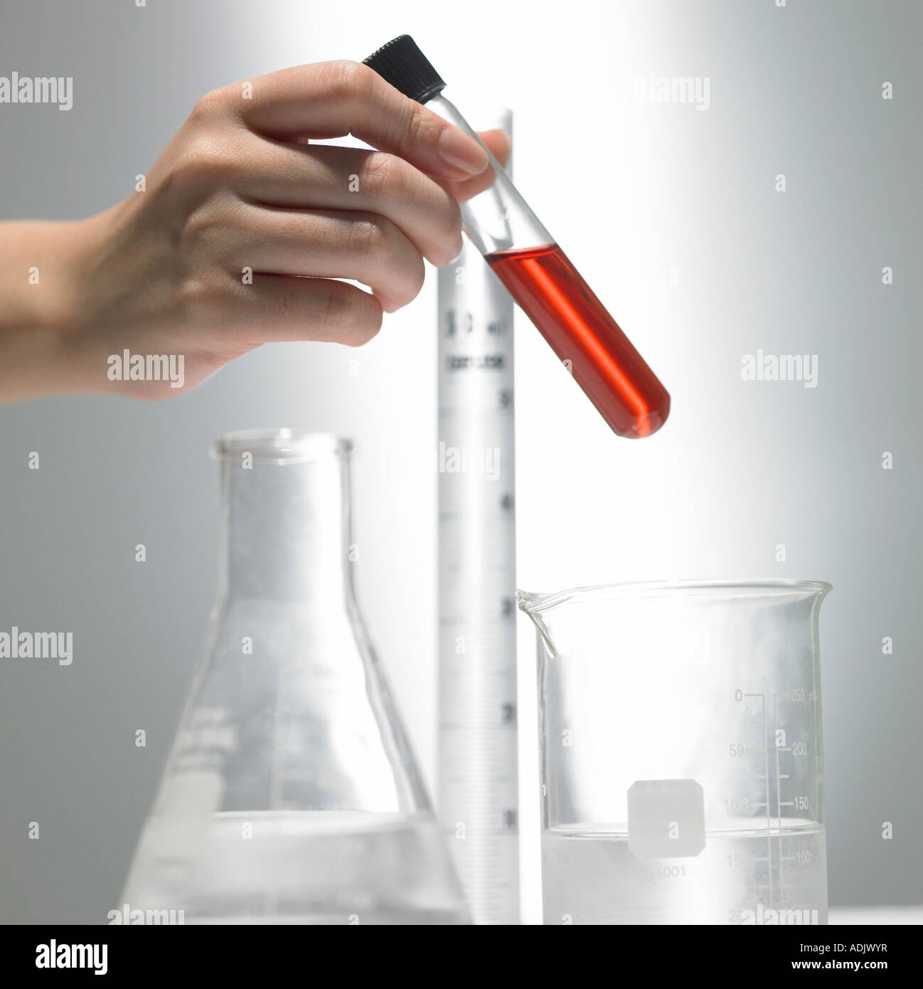 A hand making a chemical experiment in the laboratory Stock Photo - Alamy