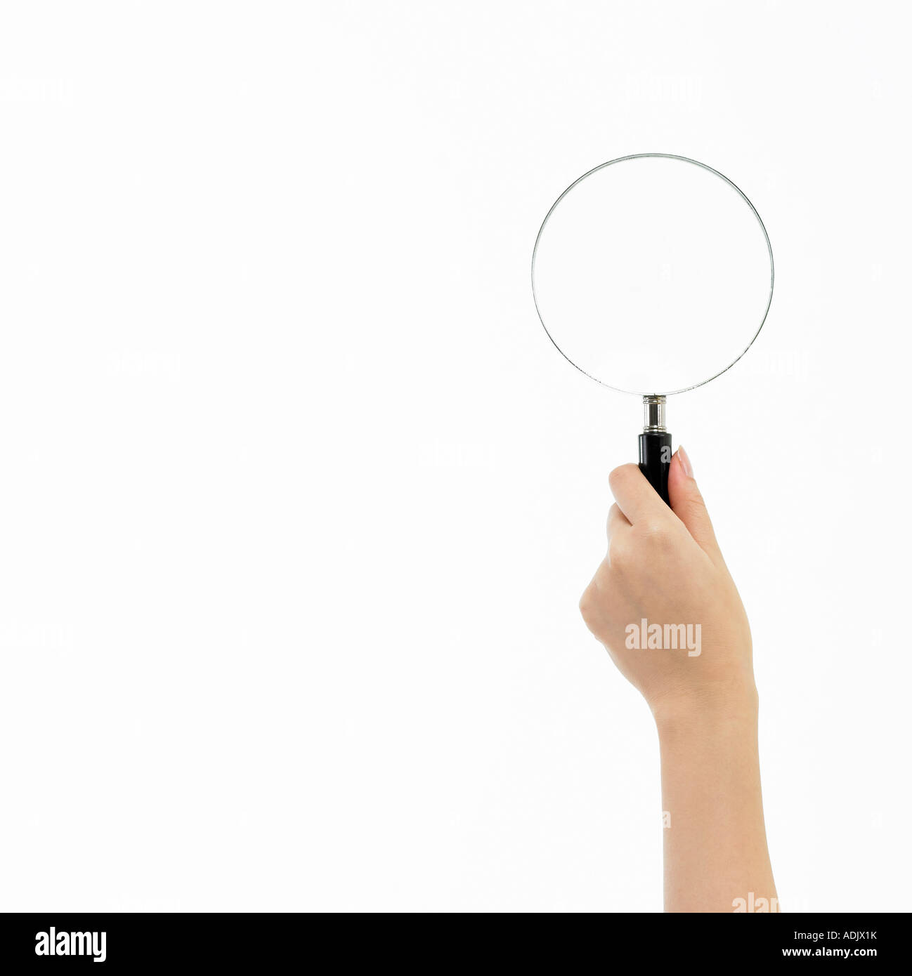 A hand holding magnifier Stock Photo - Alamy