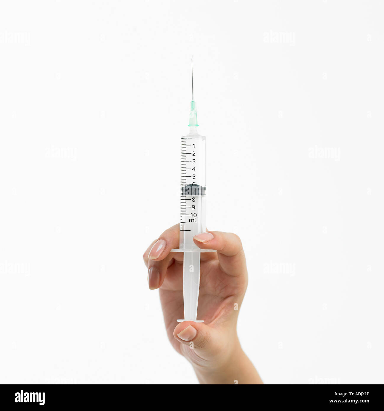 A hand holding injector Stock Photo - Alamy