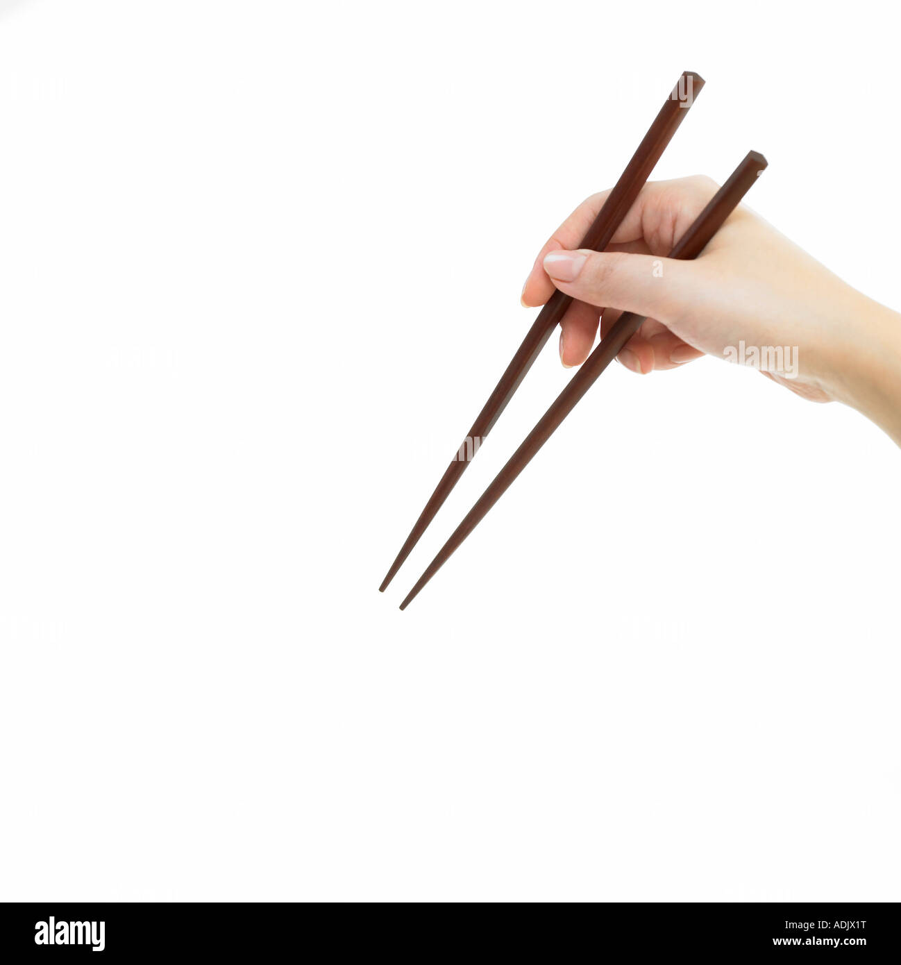 A hand holding chopsticks Stock Photo - Alamy