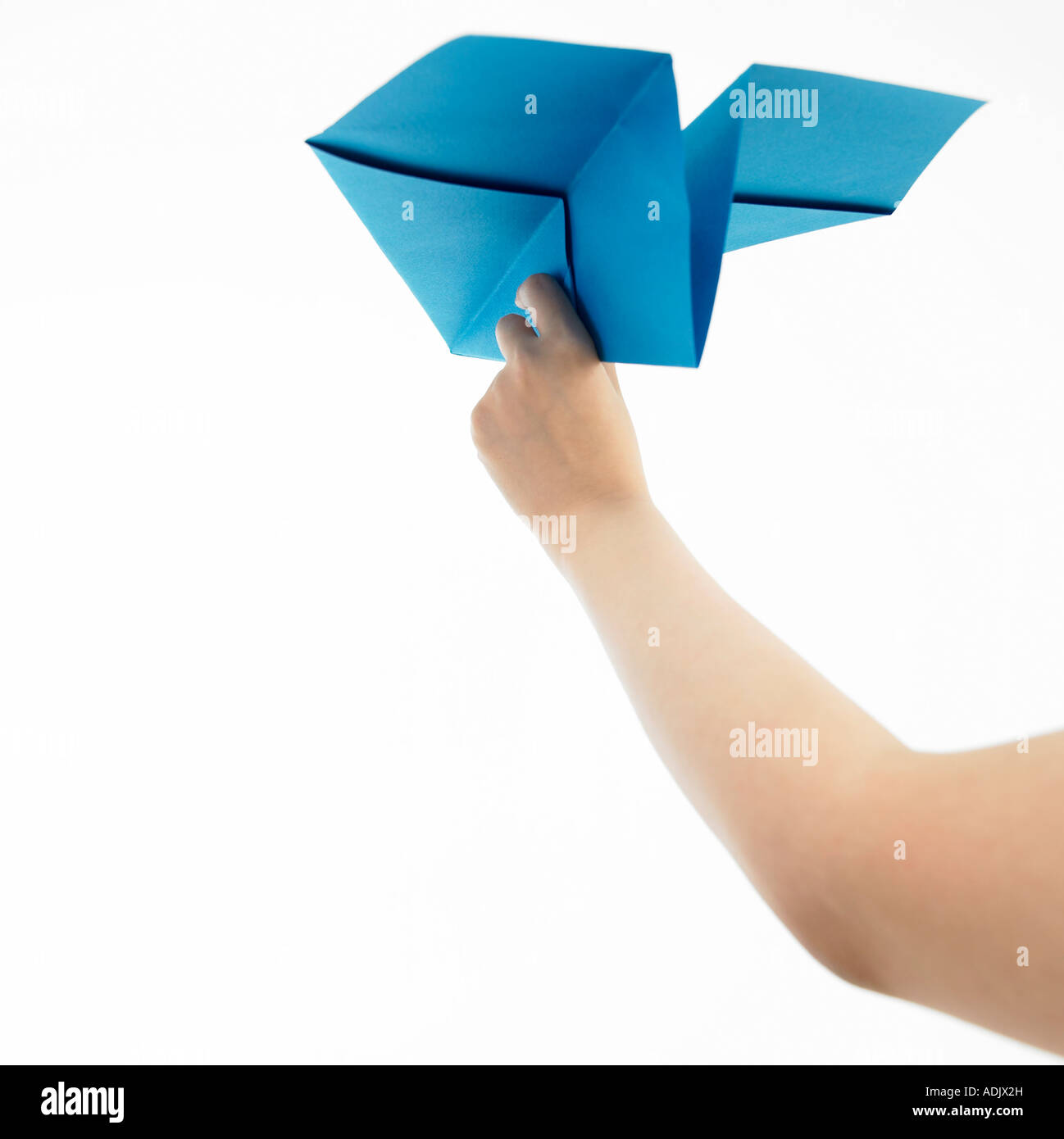 A hand holding paper airplane Stock Photo - Alamy