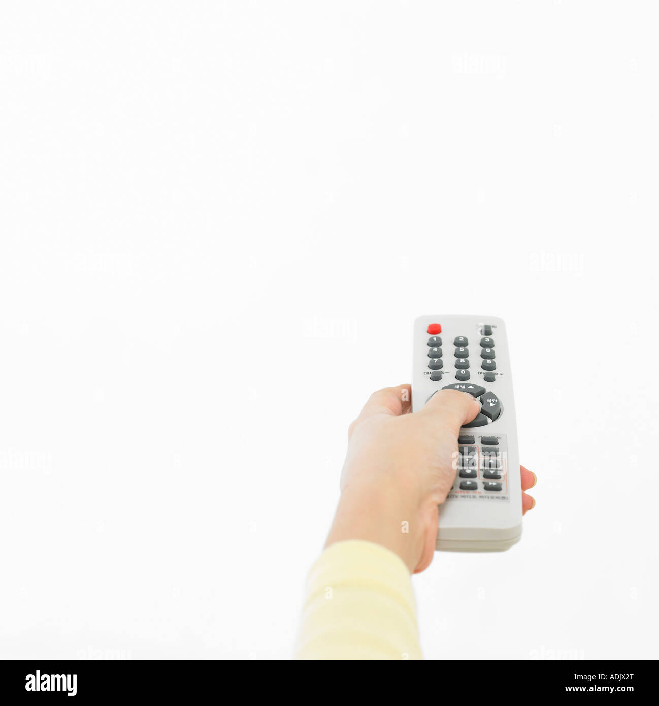 A hand holding remote control Stock Photo - Alamy