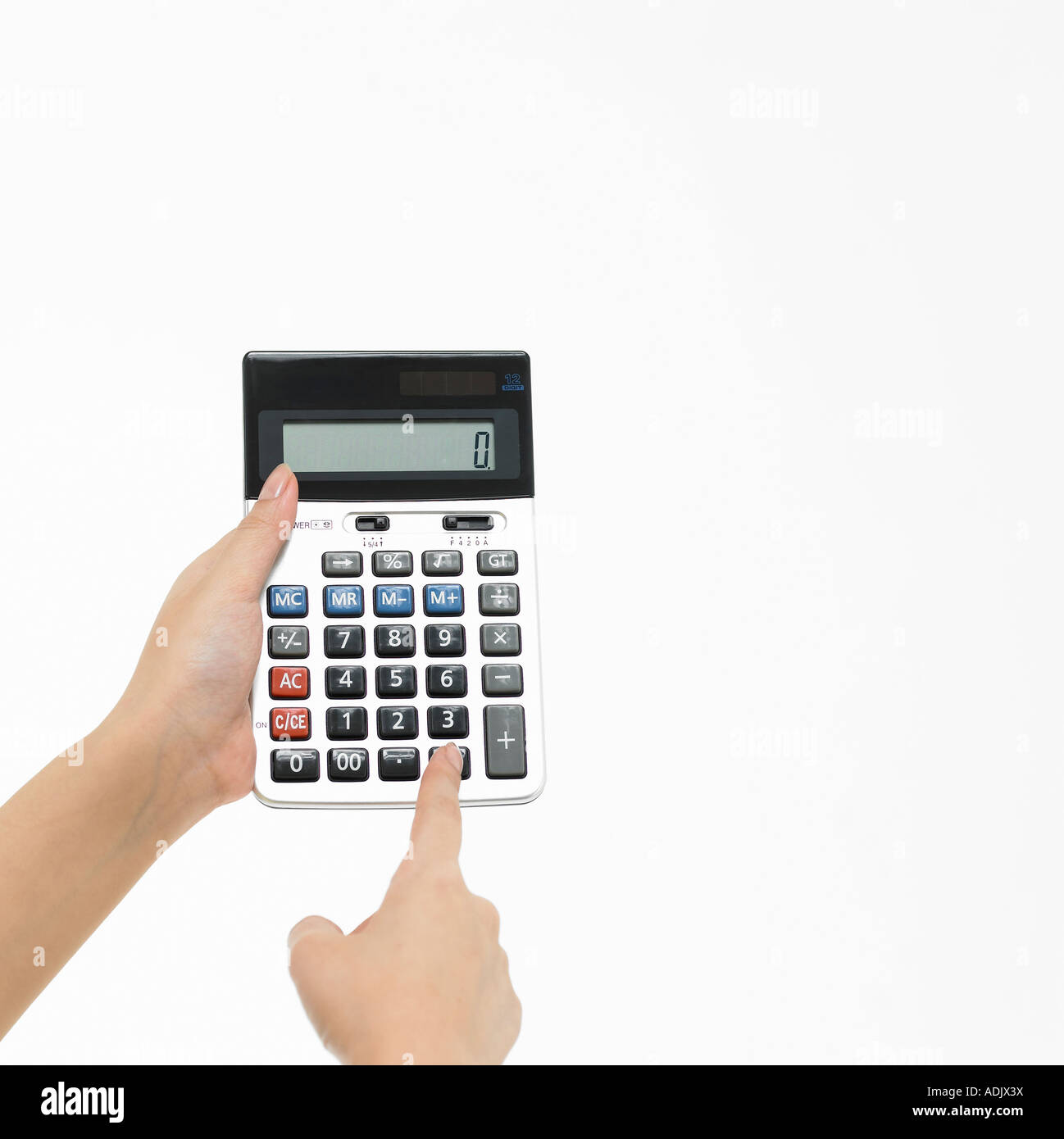 A hand holding a calculator Stock Photo - Alamy