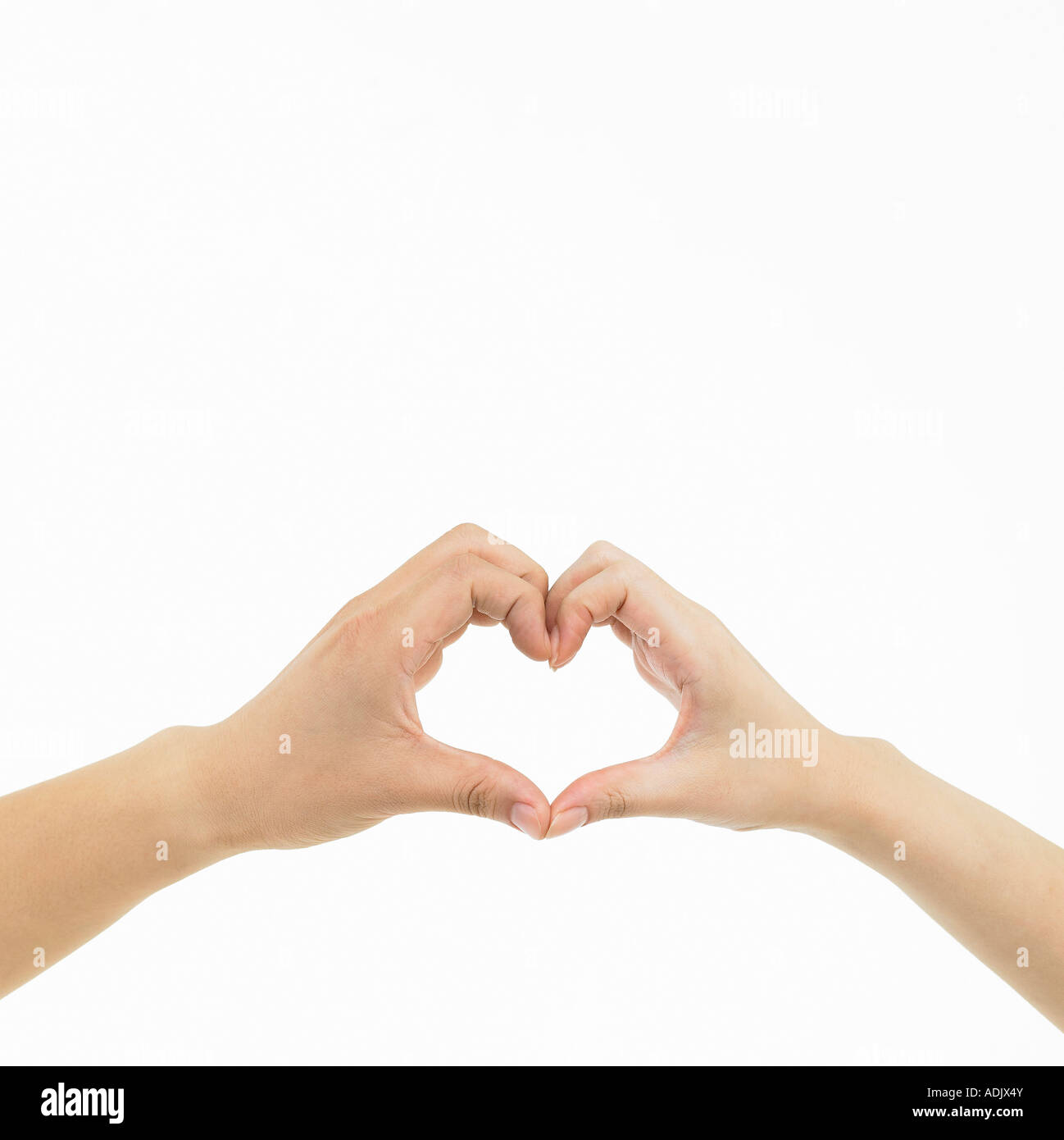 Two hands making a heart Stock Photo - Alamy