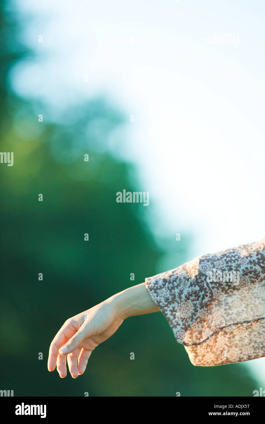 Young woman wearing translucent blouse, cropped view of arm Stock Photo ...