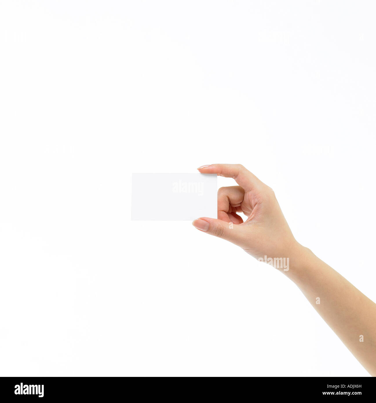 A hand holding a sheet of white paper Stock Photo - Alamy