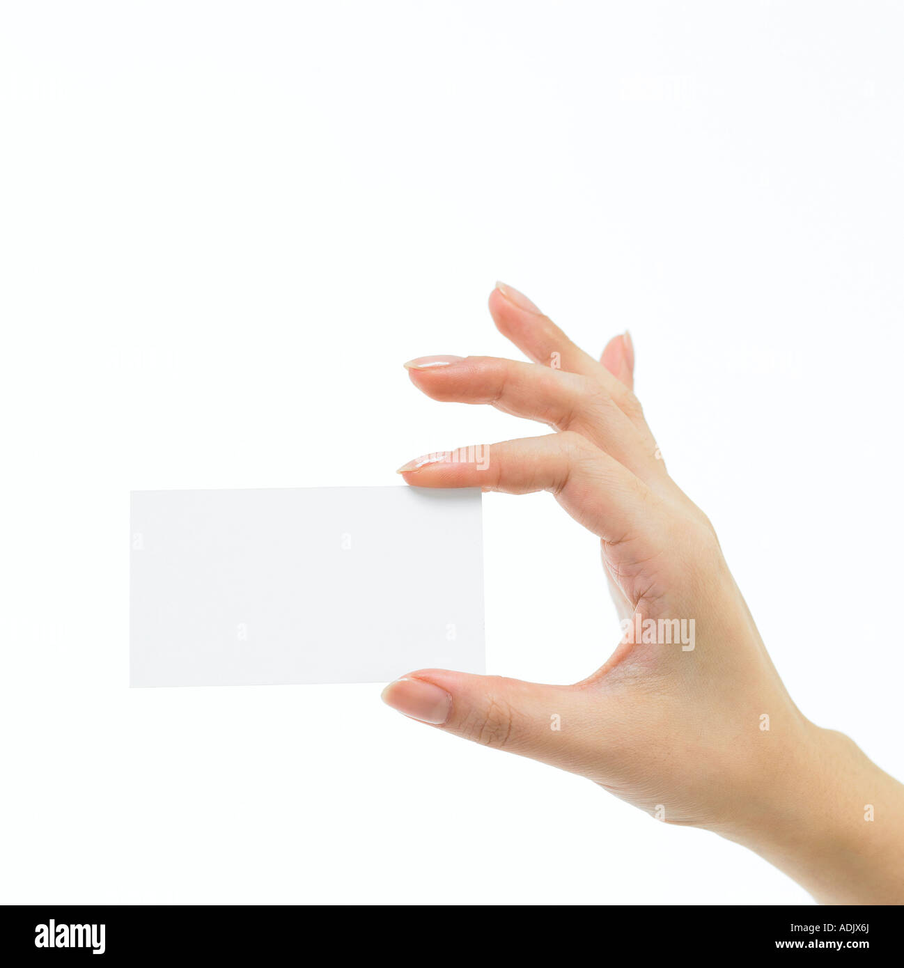 A hand holding a sheet of white paper Stock Photo - Alamy