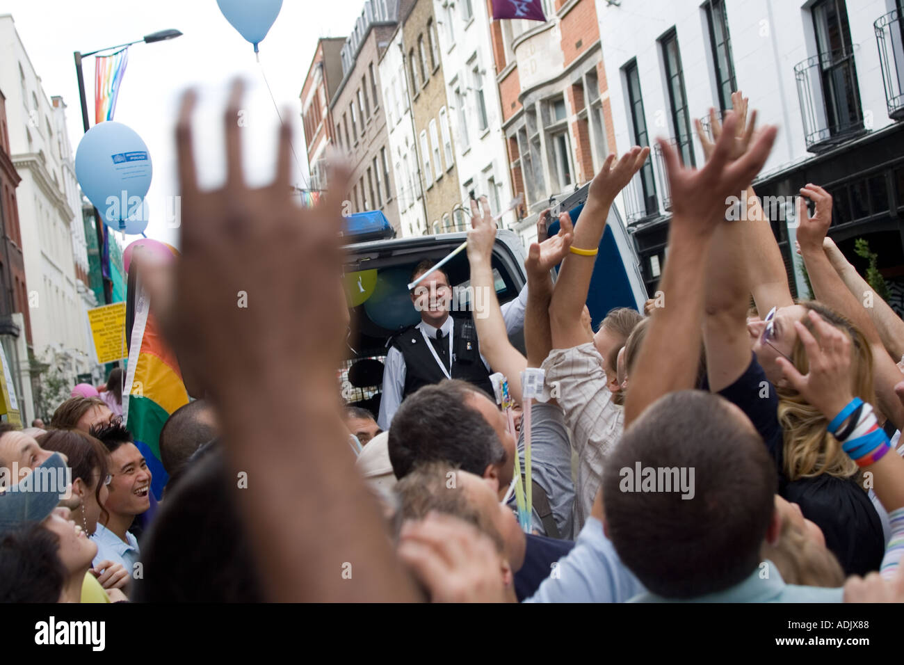 Police throwing gadgets to members of the public at soho pride festival ...