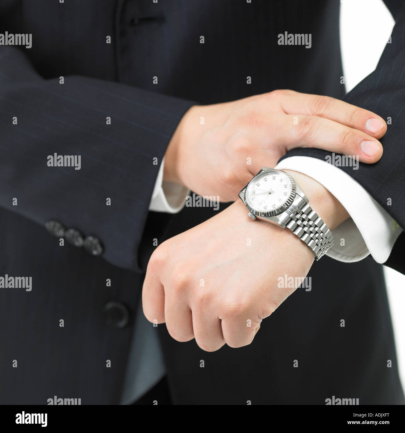 A businessman watching his watch Stock Photo - Alamy