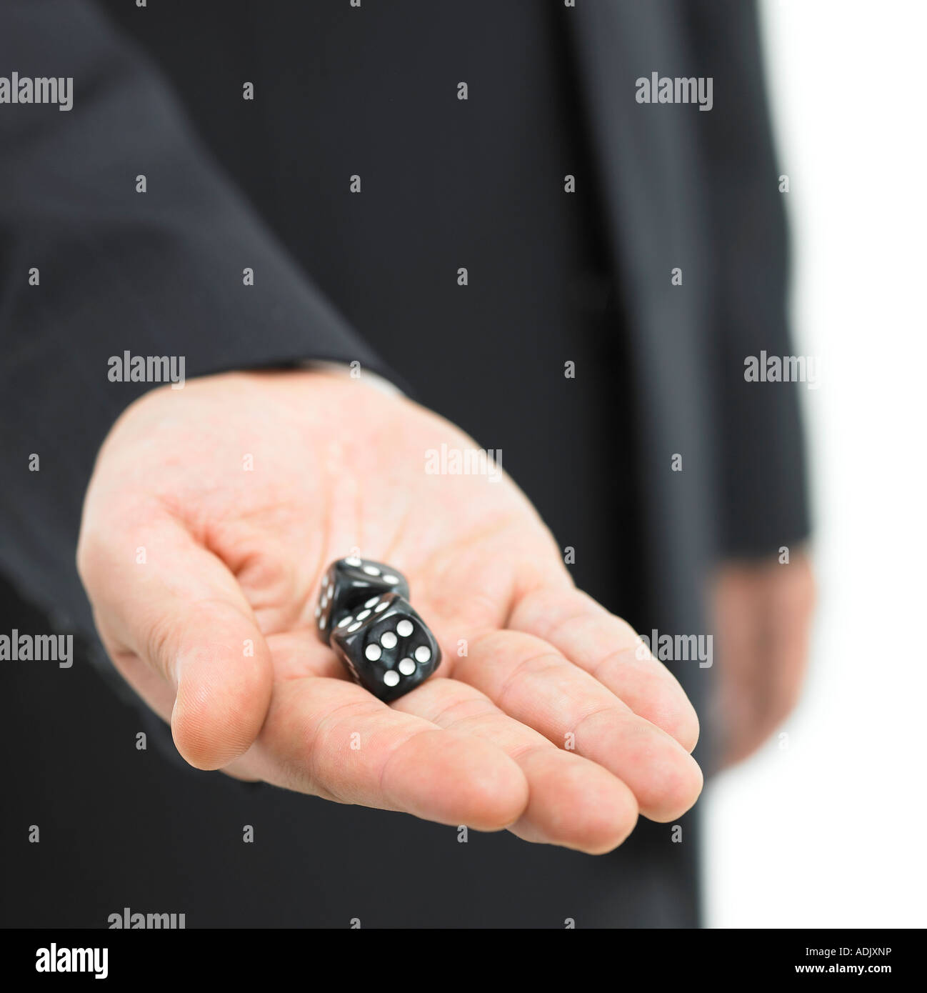 A man holding dice Stock Photo - Alamy