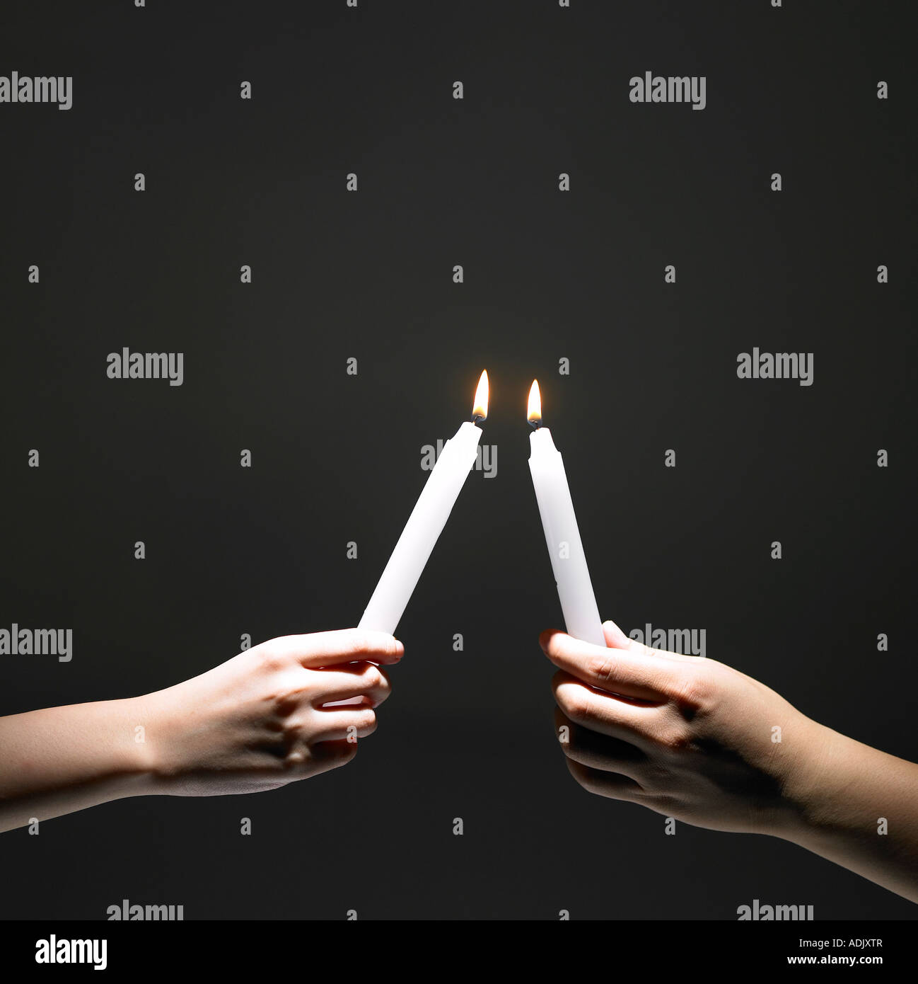 Two hands holding a candlelight Stock Photo - Alamy