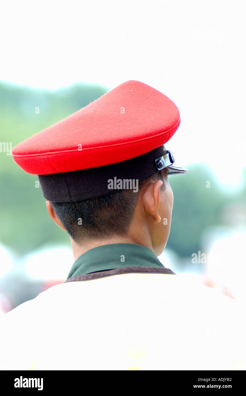 Backshot of policeman in red cap Stock Photo - Alamy