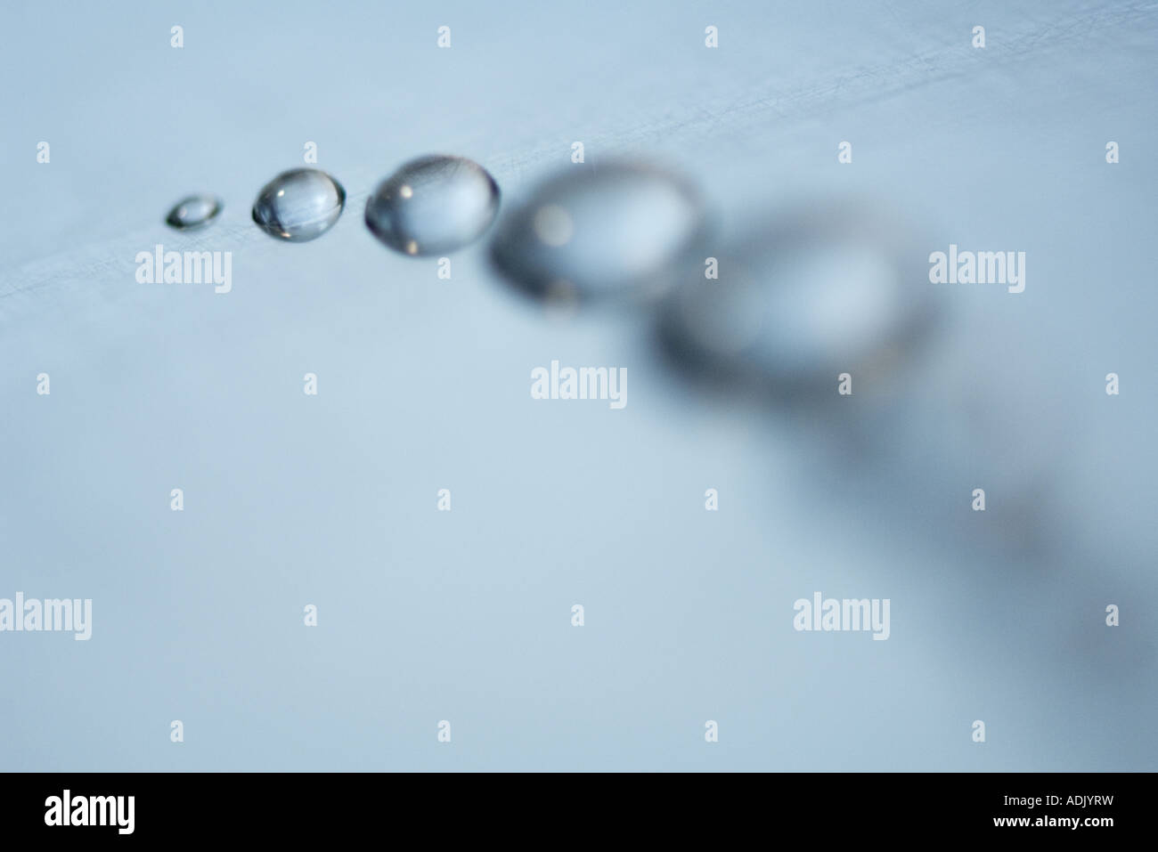 Drops of water in line Stock Photo - Alamy