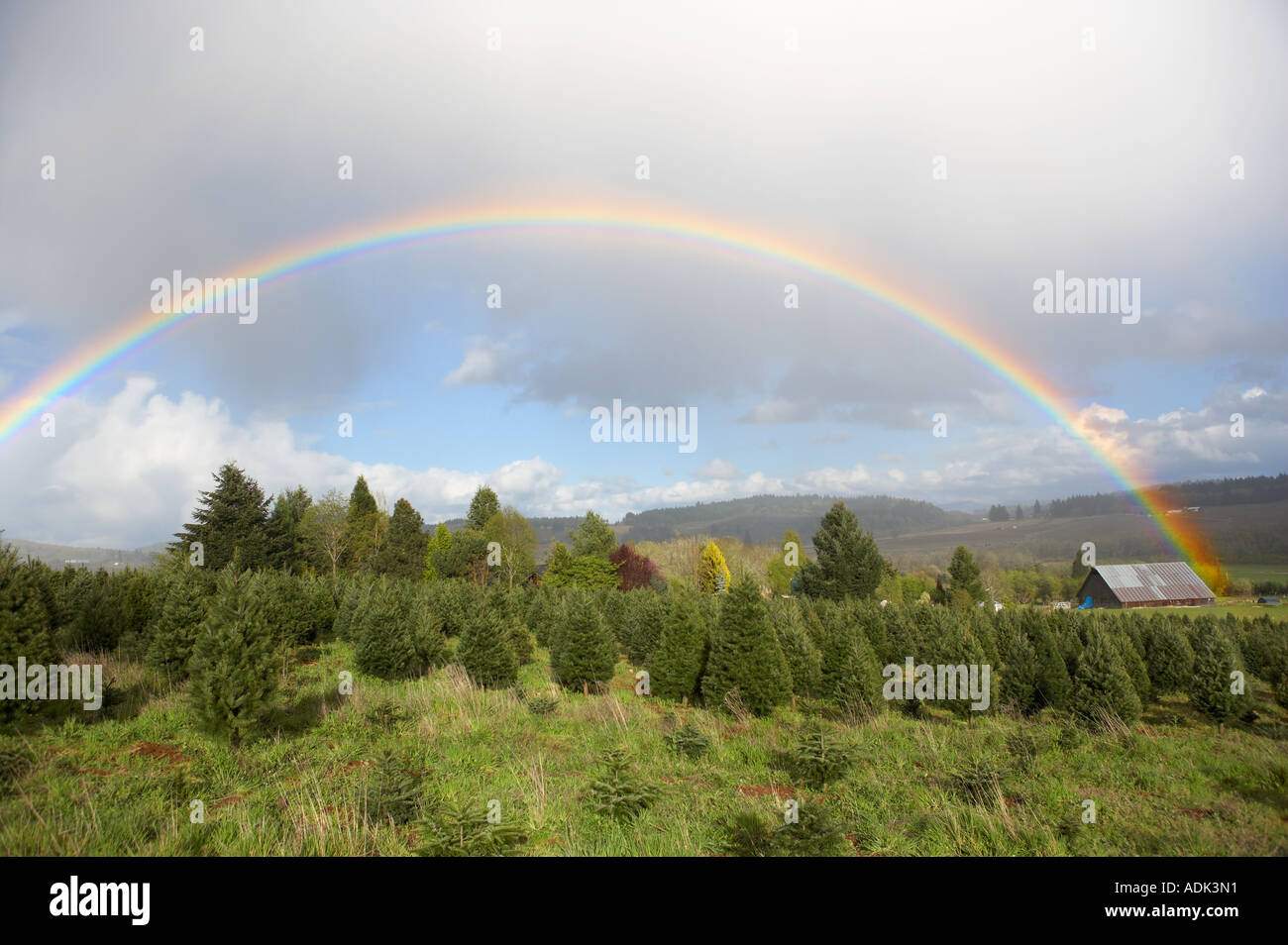 Thunderstorm clouds with rainbow and barn over Monroe Oregon Stock ...