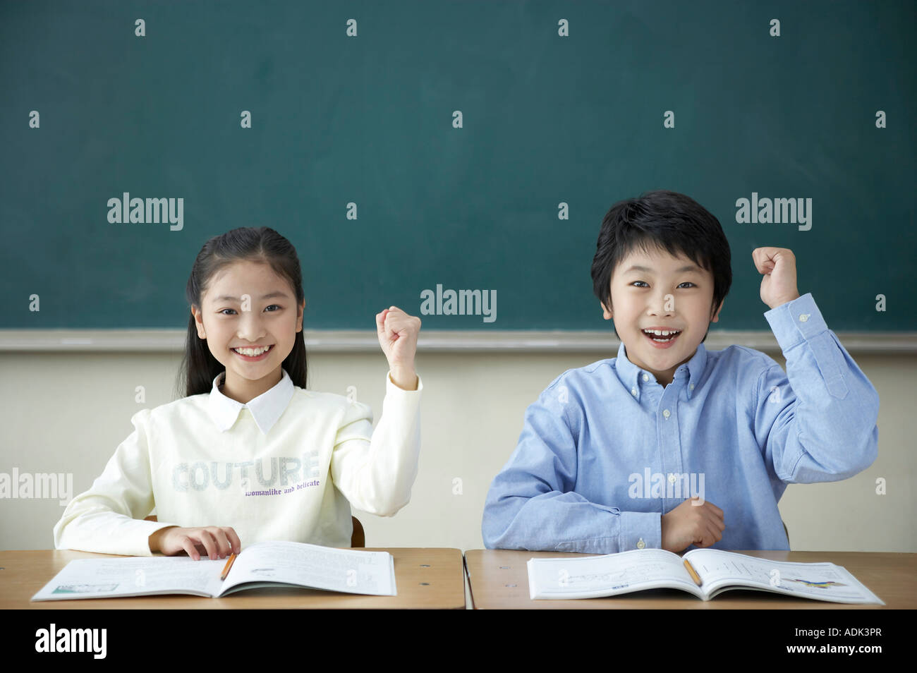 School children fighting in classroom hi-res stock photography and ...