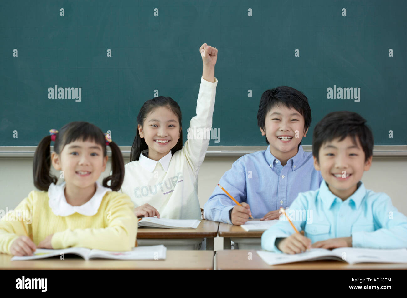 Smiling students in the class Stock Photo - Alamy