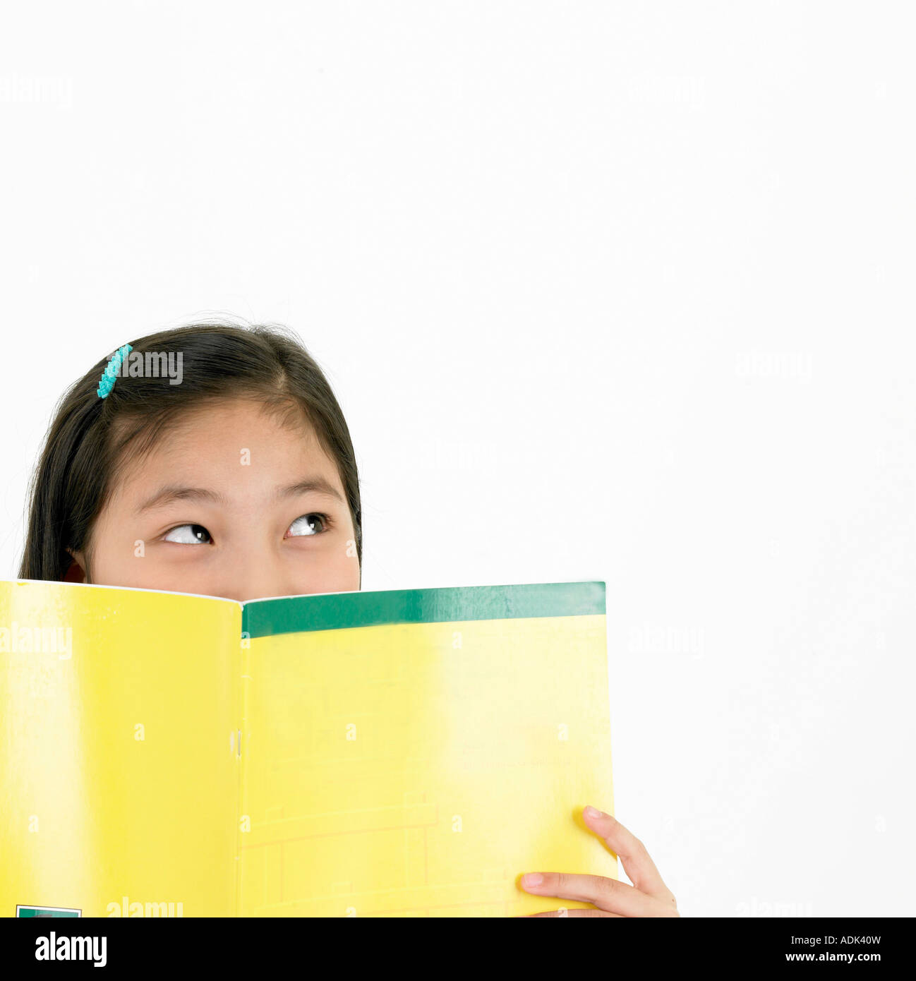 a girl thinking with a book Stock Photo - Alamy