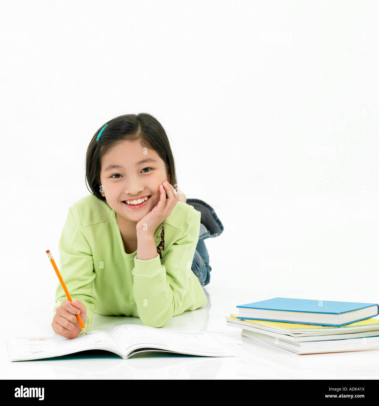 a girl studying with a smile Stock Photo - Alamy