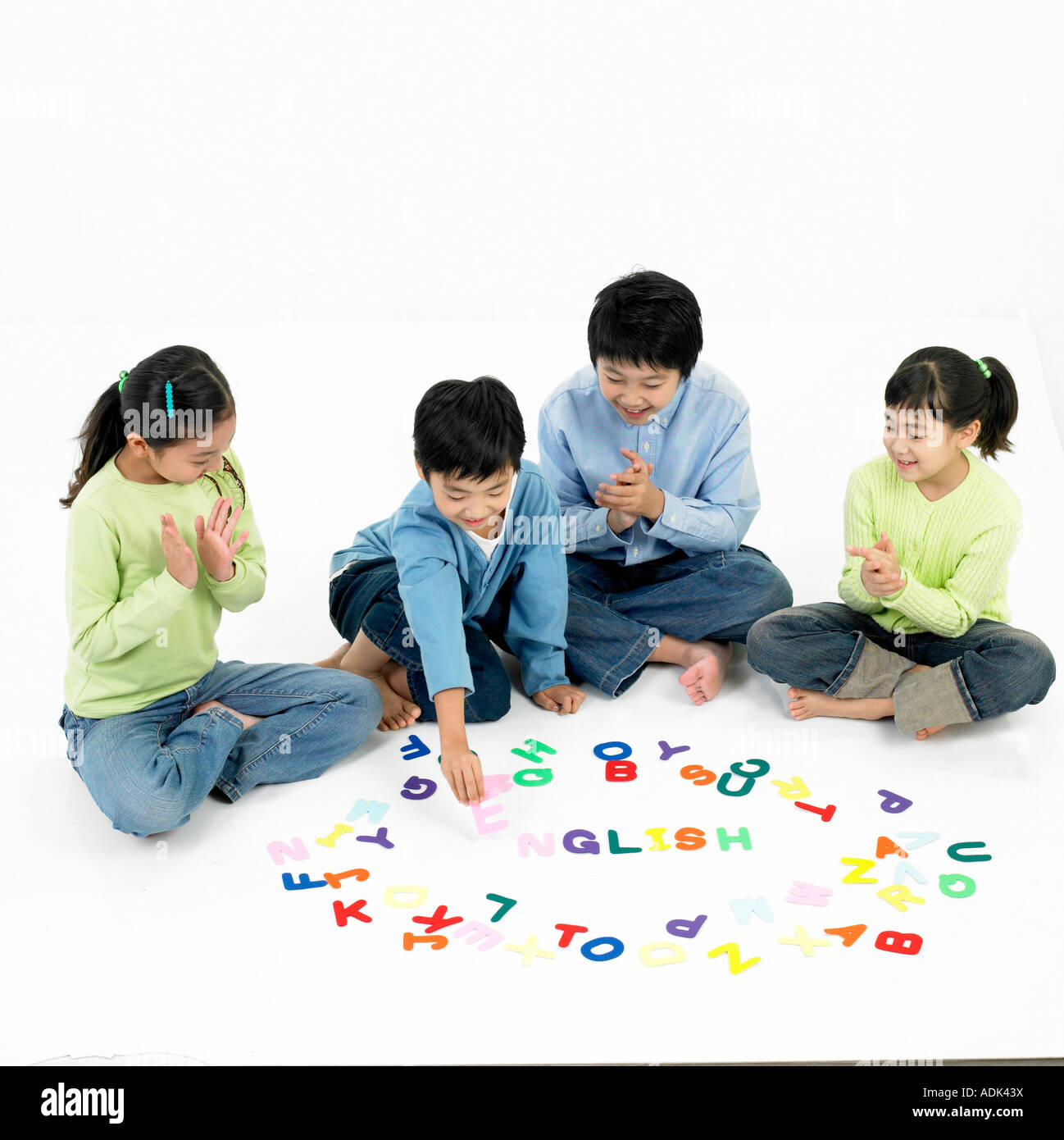 students doing a puzzle with English letters Stock Photo - Alamy