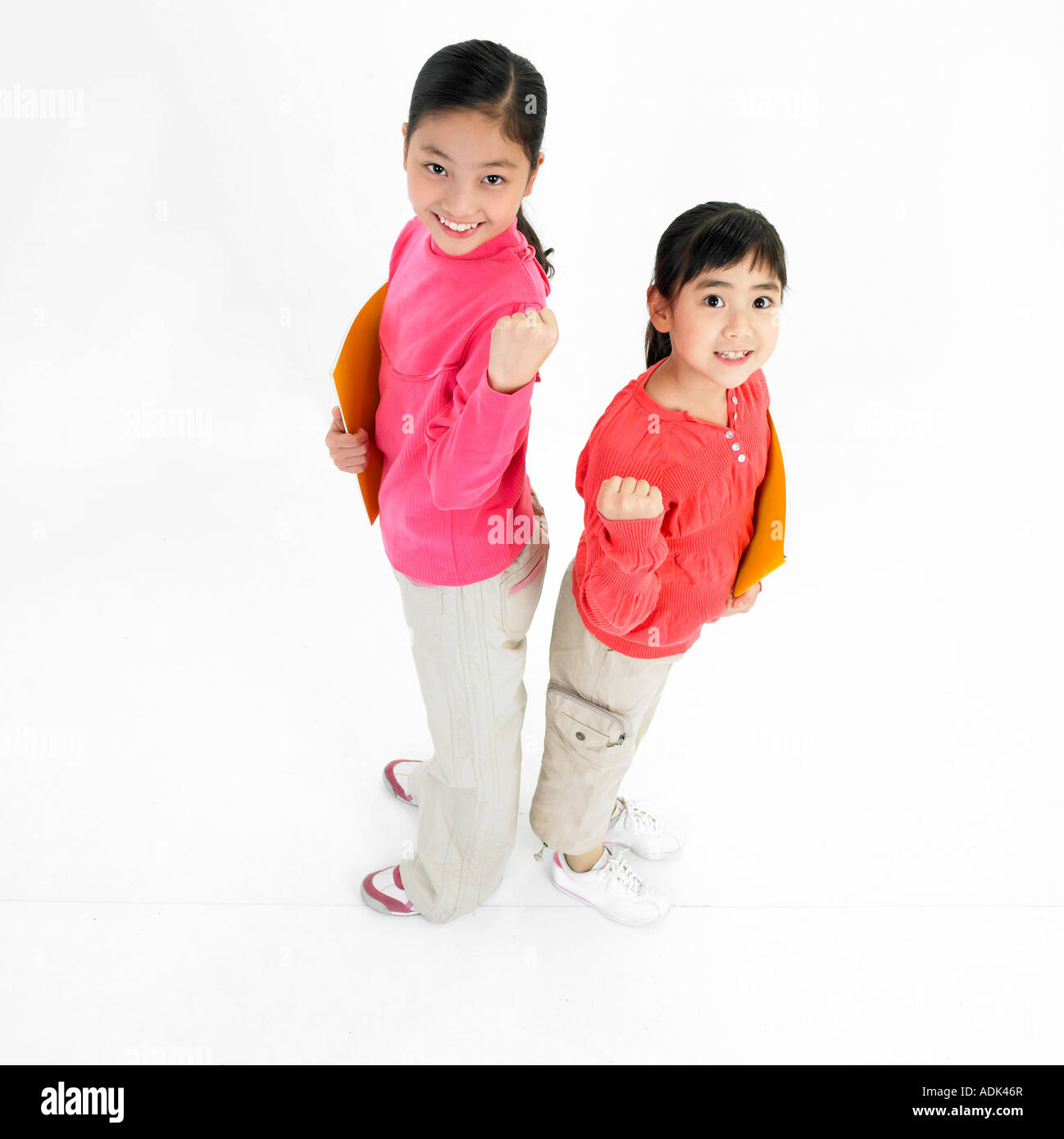 girls making a fist with a smile Stock Photo - Alamy