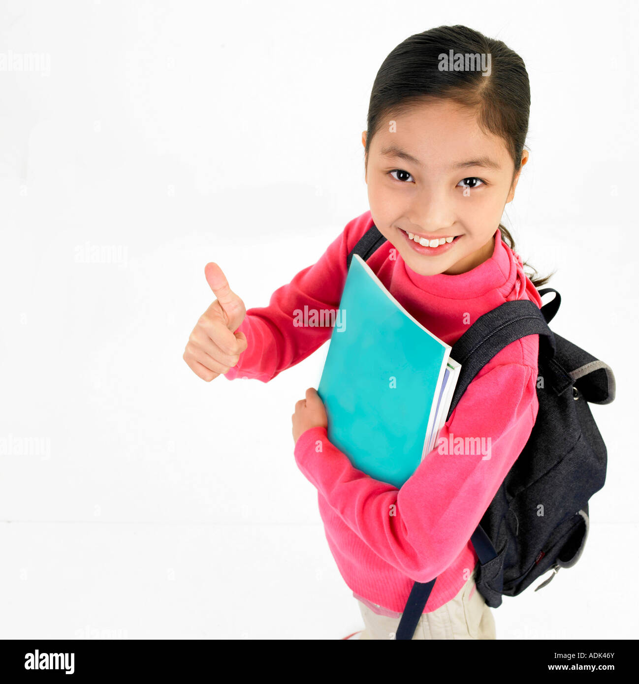 a girl going to school with a smile Stock Photo - Alamy