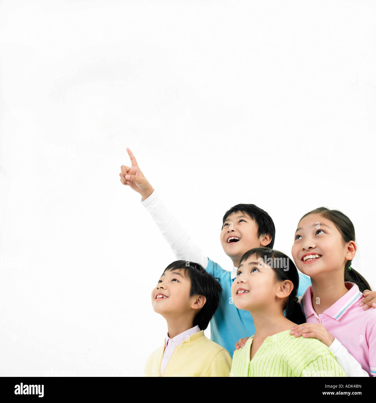 girls and boys looking up high with a smile Stock Photo - Alamy