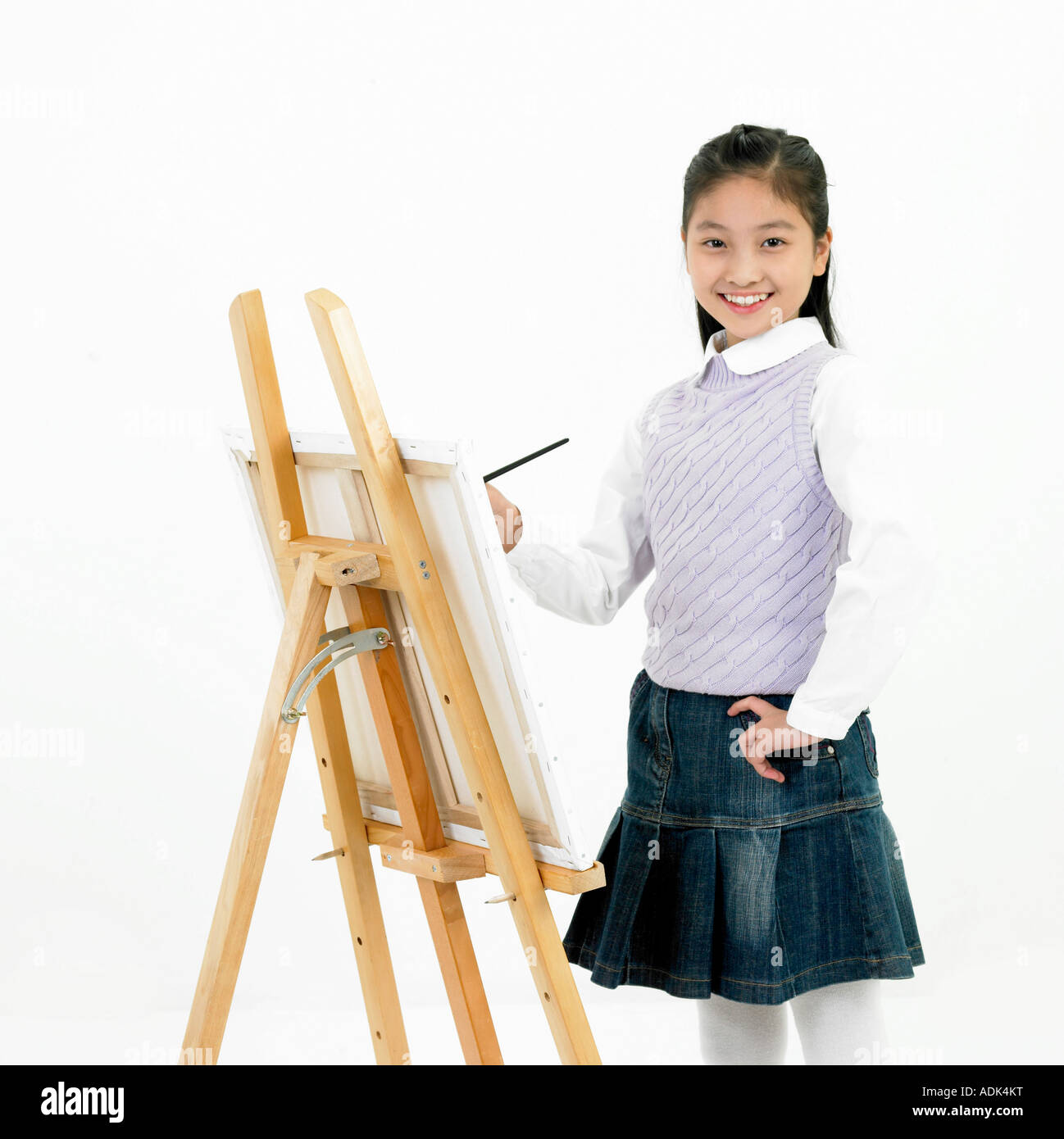a girl drawing the picture with a smile Stock Photo - Alamy