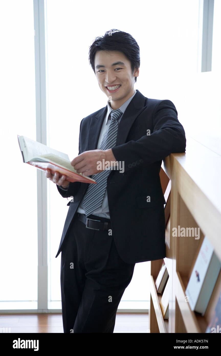 a businessman reading a book Stock Photo - Alamy