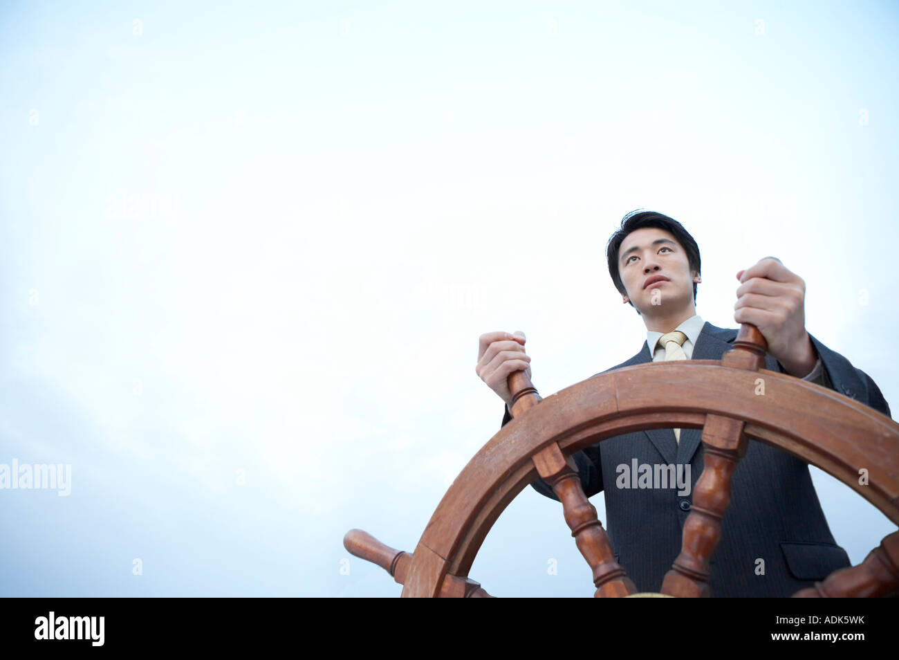 Businessman steering ship hi-res stock photography and images - Alamy