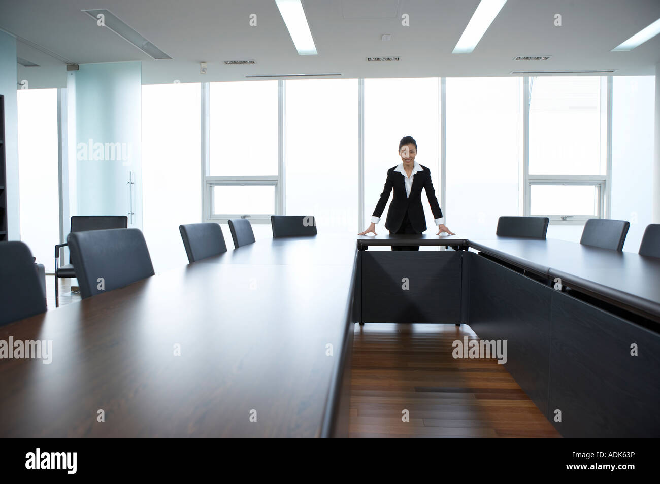 a businesswoman standing in the conference room Stock Photo - Alamy