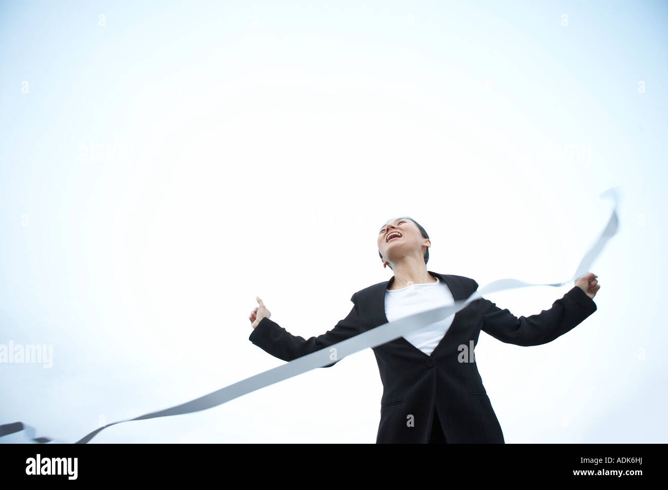 a businesswoman reaching finish line Stock Photo - Alamy