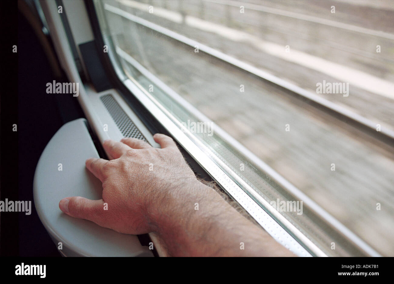 view of tracks and hand from moving train window Stock Photo - Alamy