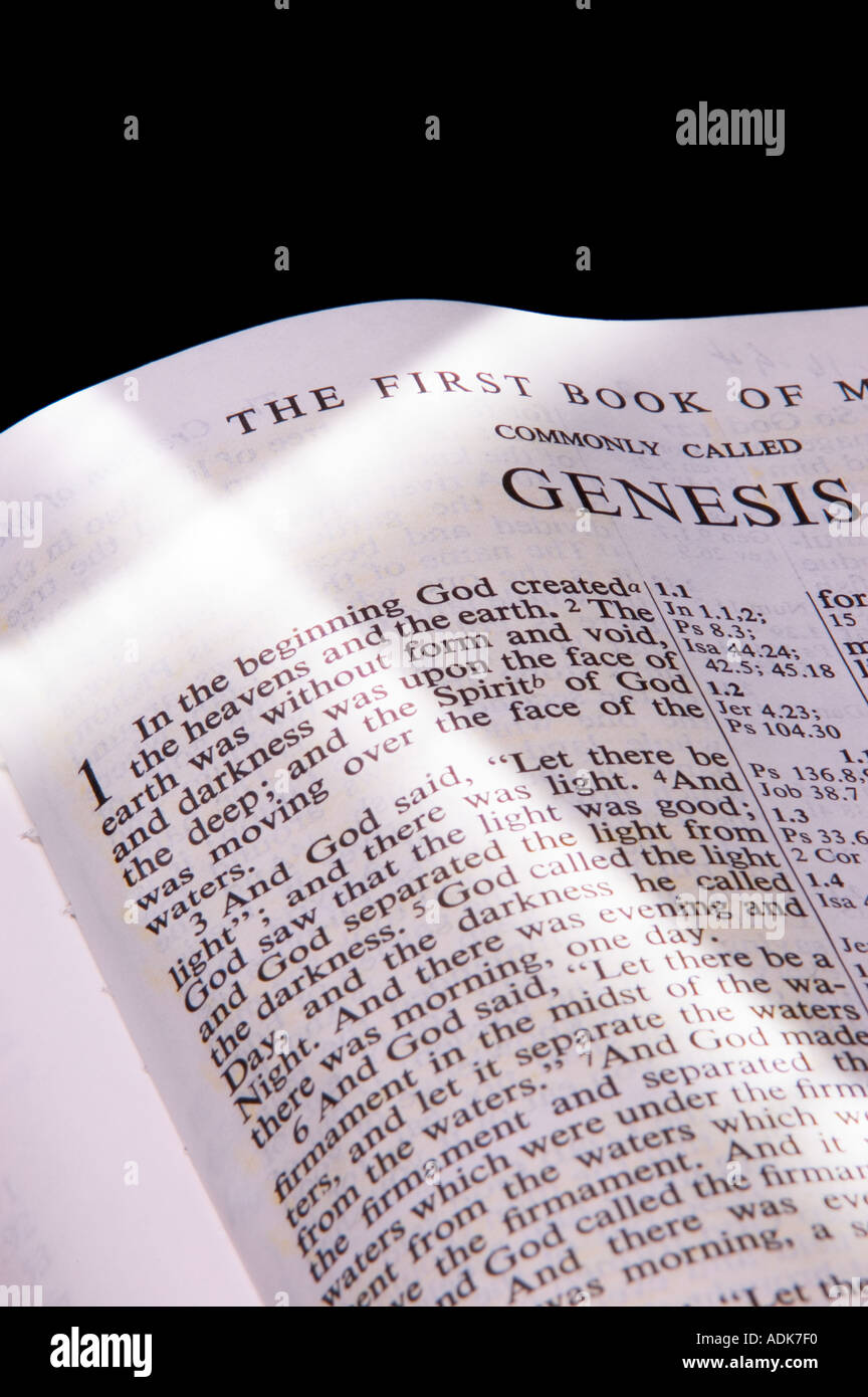 Open Bible with Cross lighting Stock Photo - Alamy