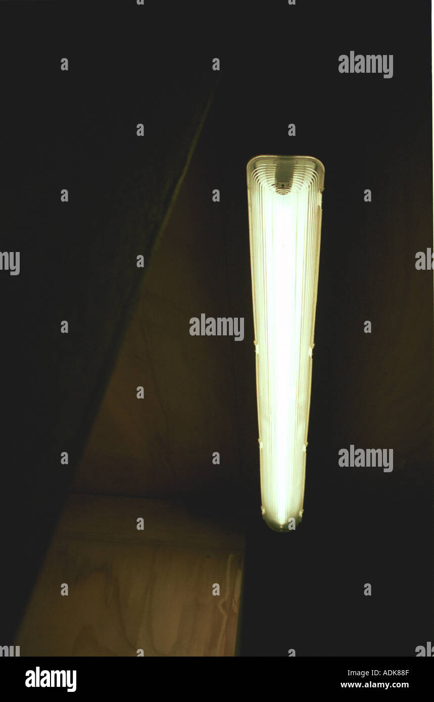 fluorescent light strip on boarded up area Stock Photo - Alamy