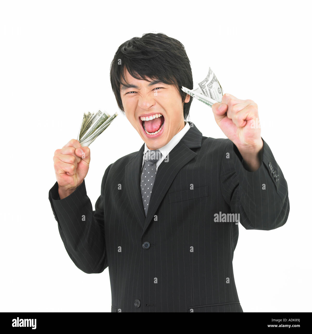 A businessman smile grabbing money Stock Photo - Alamy