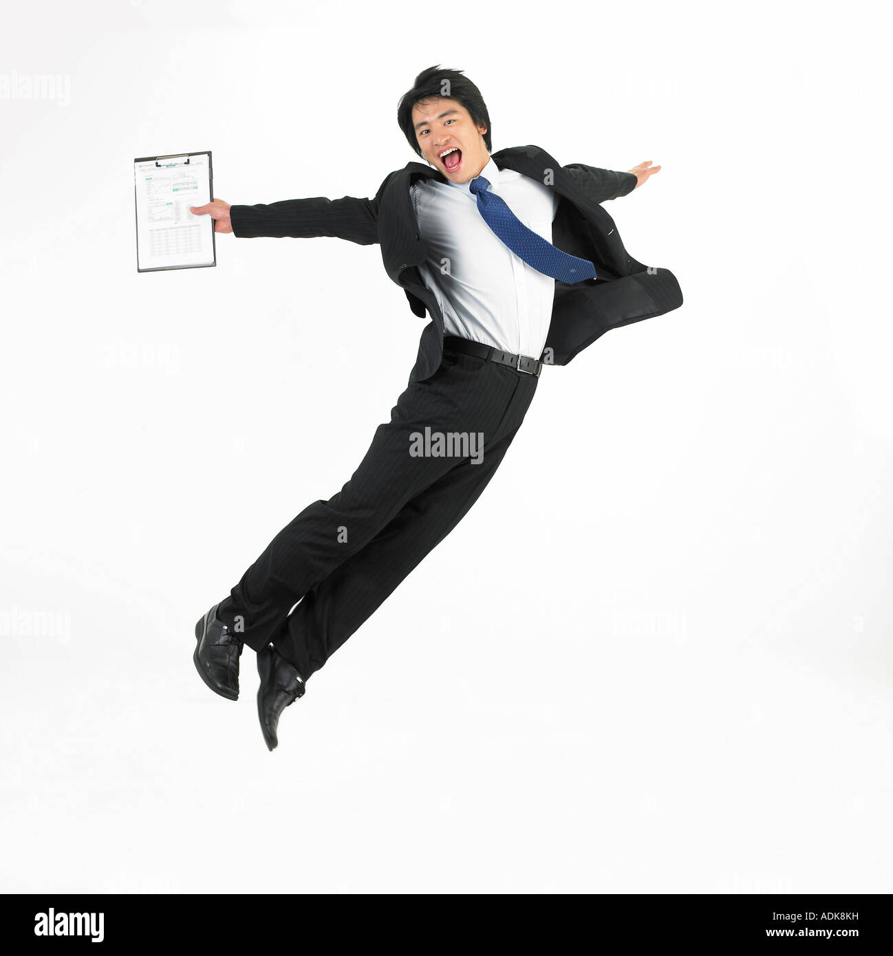 a businessman jumping up Stock Photo - Alamy